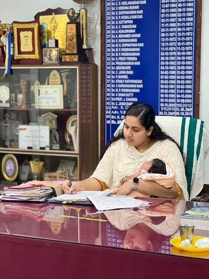 Photo of Kerala Mayor Arya Rajendran at work with her infant raises ...
