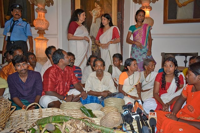In line with Onam tradition, people from Kani tribe offer gifts to ...