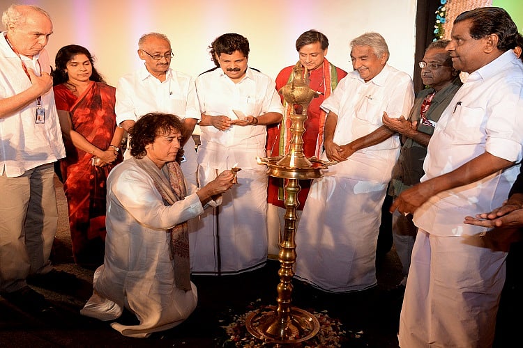 Ustaad Zakir Hussain goes on his knees to light inaugural lamp at IFFK