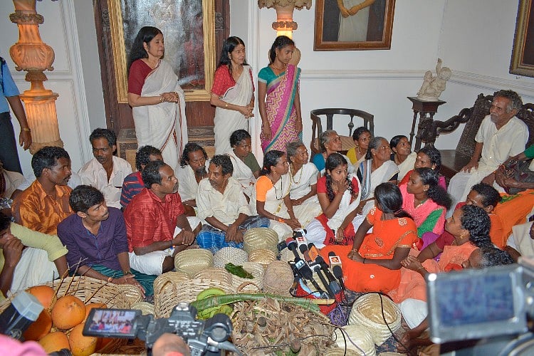 In line with Onam tradition, people from Kani tribe offer gifts to ...