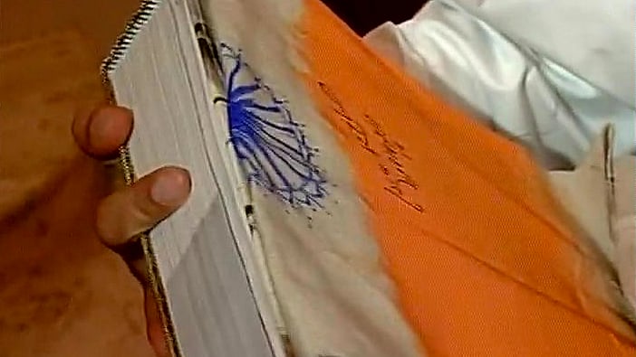 PM Narendra Modi Autographs the Indian Flag for US President Obama