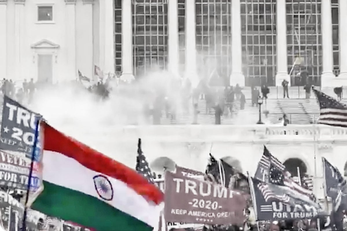 Indian flag waved in the middle of mob at the attack on US Capitol building