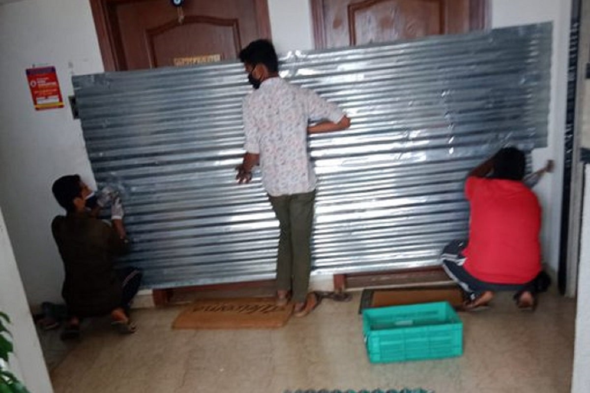 BBMP barricades 2 apartments with COVID-19 patients using tin sheets ...