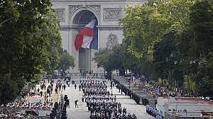 France celebrates national day as political crisis rumbles on