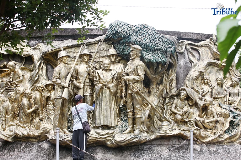 Caretaker tends Tandang Sora mural on National Heroes Day