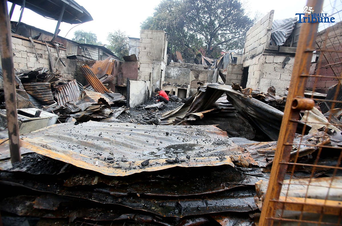 Quezon City blaze leaves residents picking through ruins of homes
