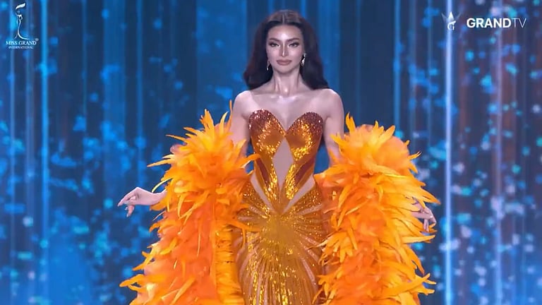Emma Tiglao shines in a fiery orange masterpiece at Miss Grand ...