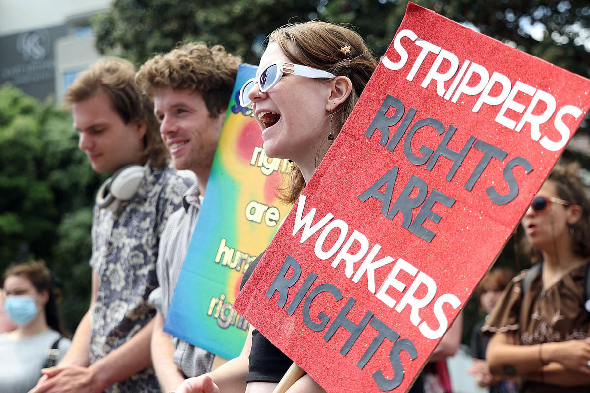 Strippers march to parliament, demand legal protections