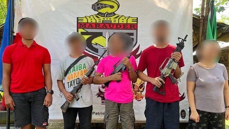 14 NPA rebels surrender 9 firearms to gov't troops