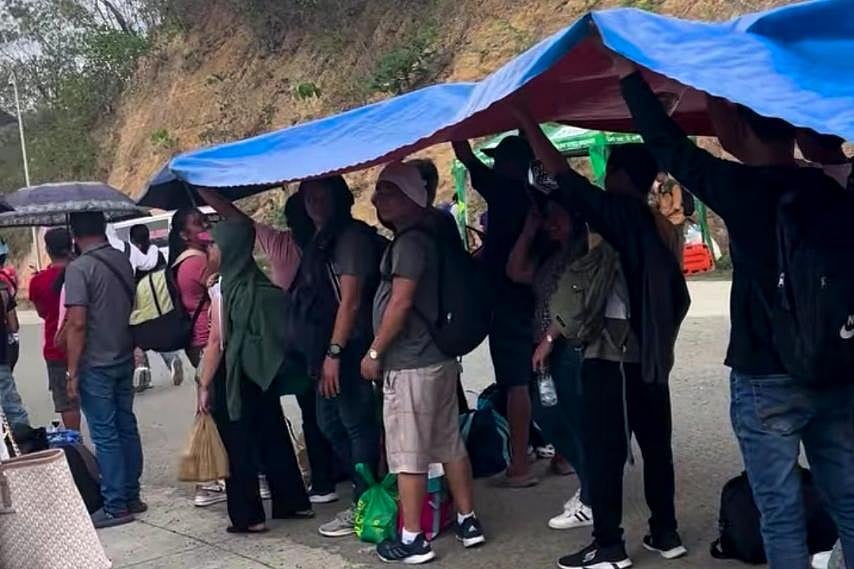 Passengers 'sunbathing' in long lines at Balanacan Port
