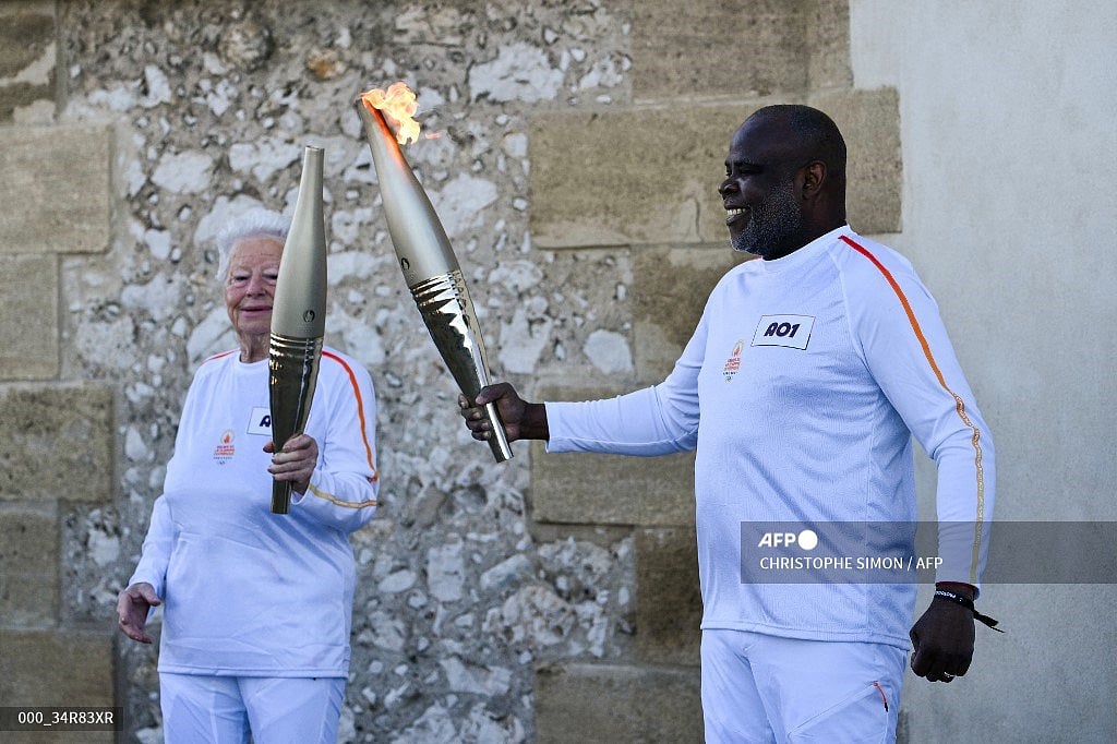 Paris Olympic flame begins relay across France