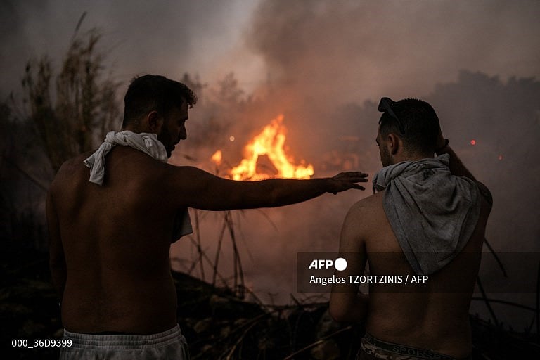 Greece still battles deadly wildfire