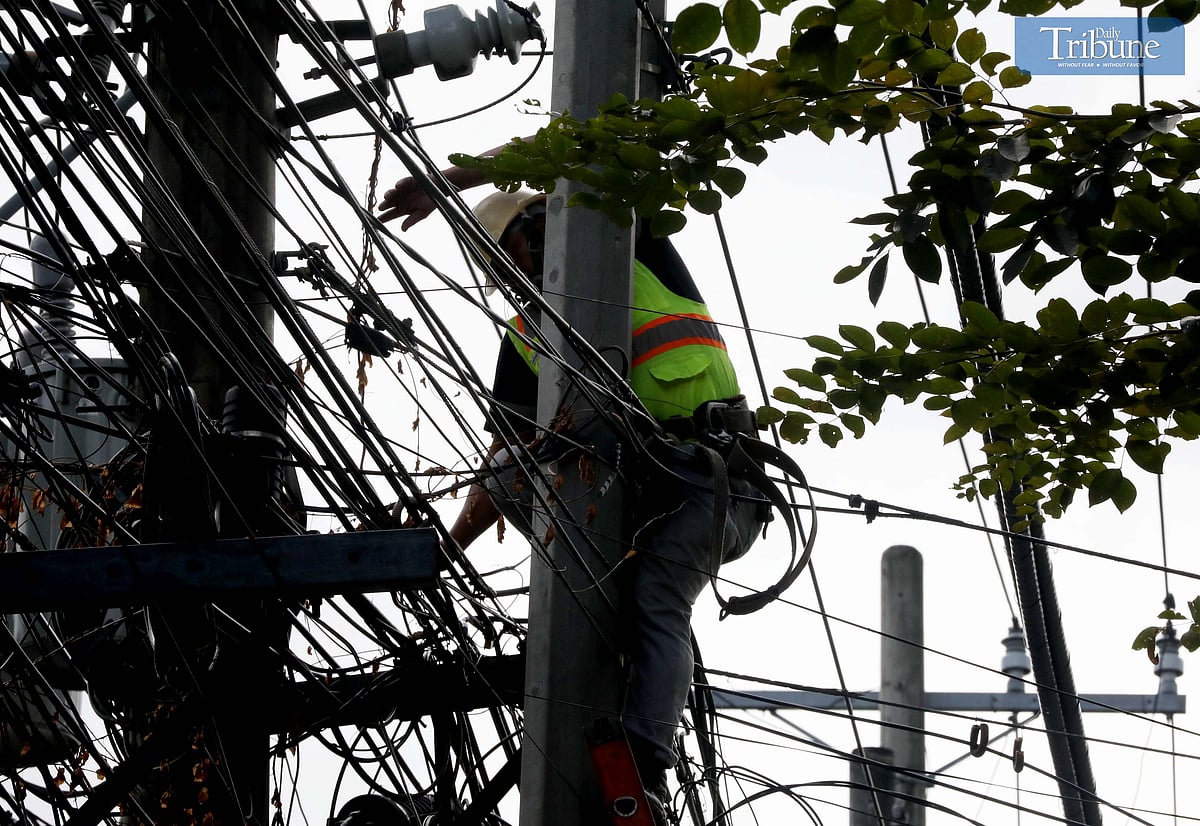 Meralco Contractor Repairs Power Lines to Address Interruptions in ...