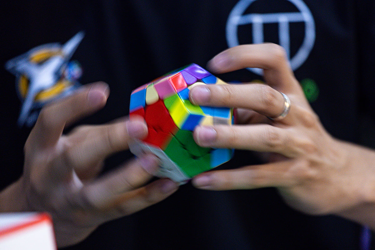 Speedcubers attempt to break records at a Rubik's competition