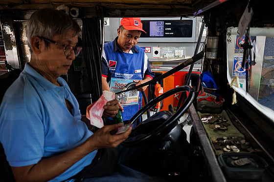 Jeepney drivers fuel up ahead of expected price hike