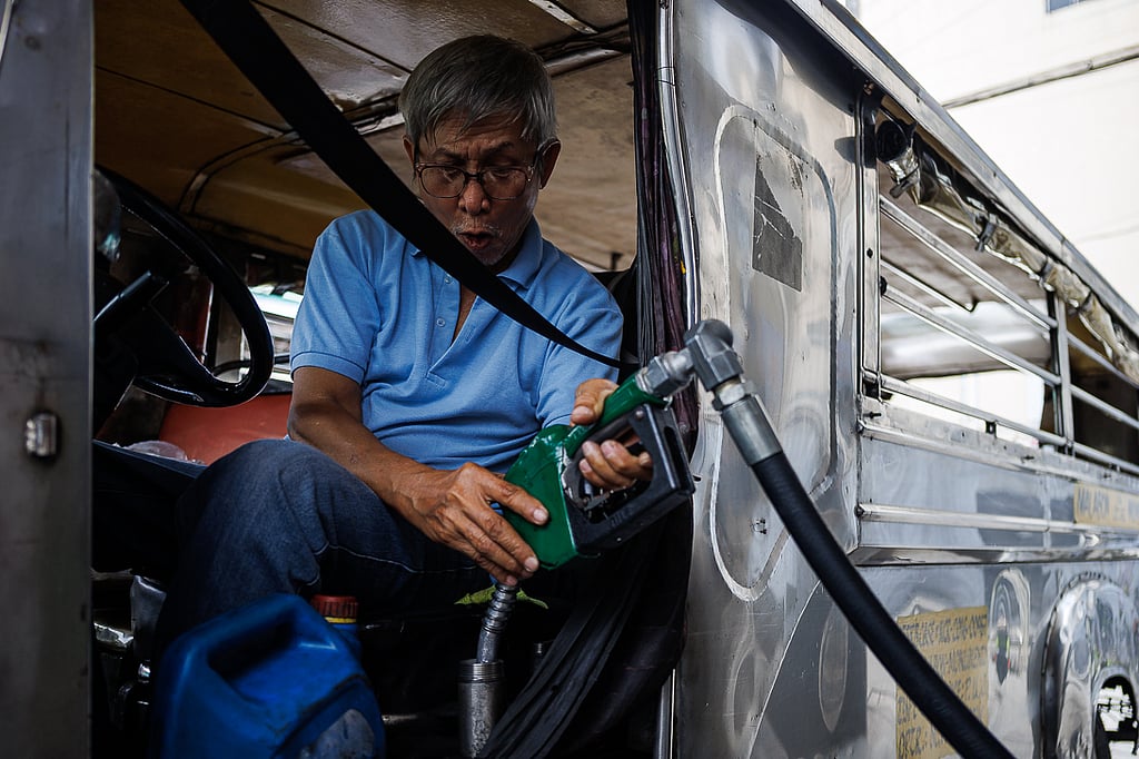 Jeepney drivers fuel up ahead of expected price hike