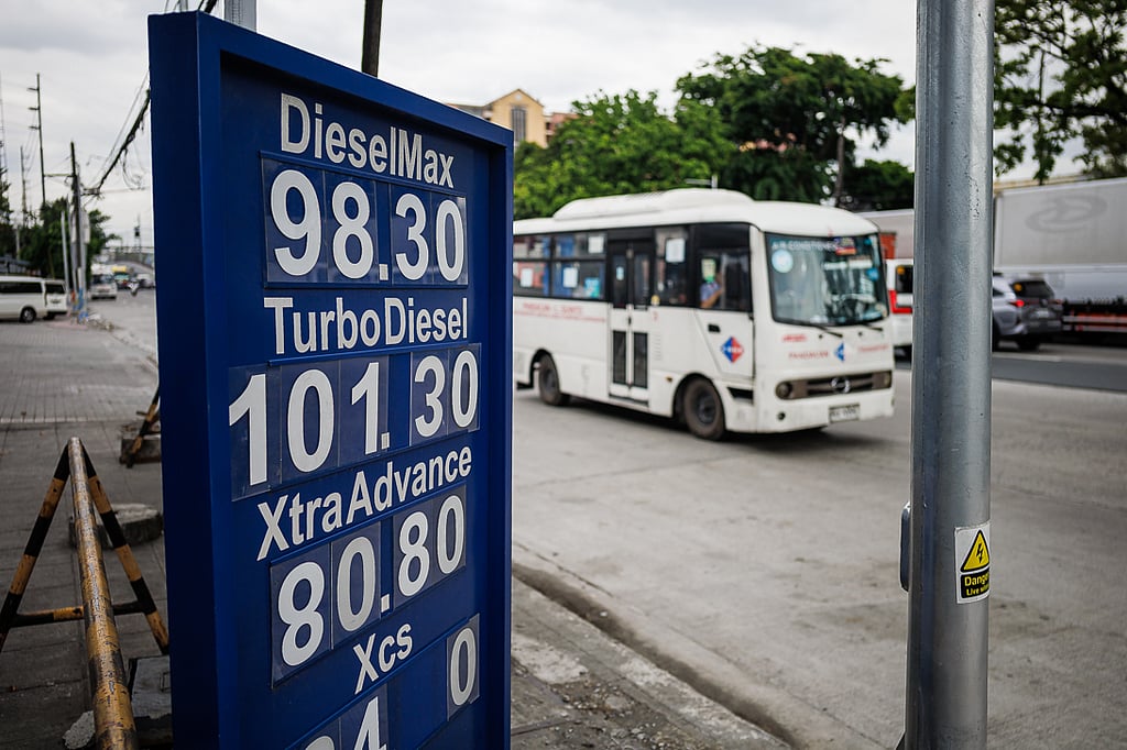 Gas stations use cardboard cutouts for their pricing displays as oil ...