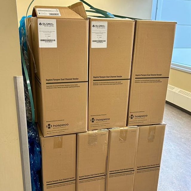 Photo shows six large cases of tampons destined for male washroom on ...