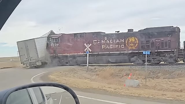 WATCH: Train splits semi truck in two near Taber