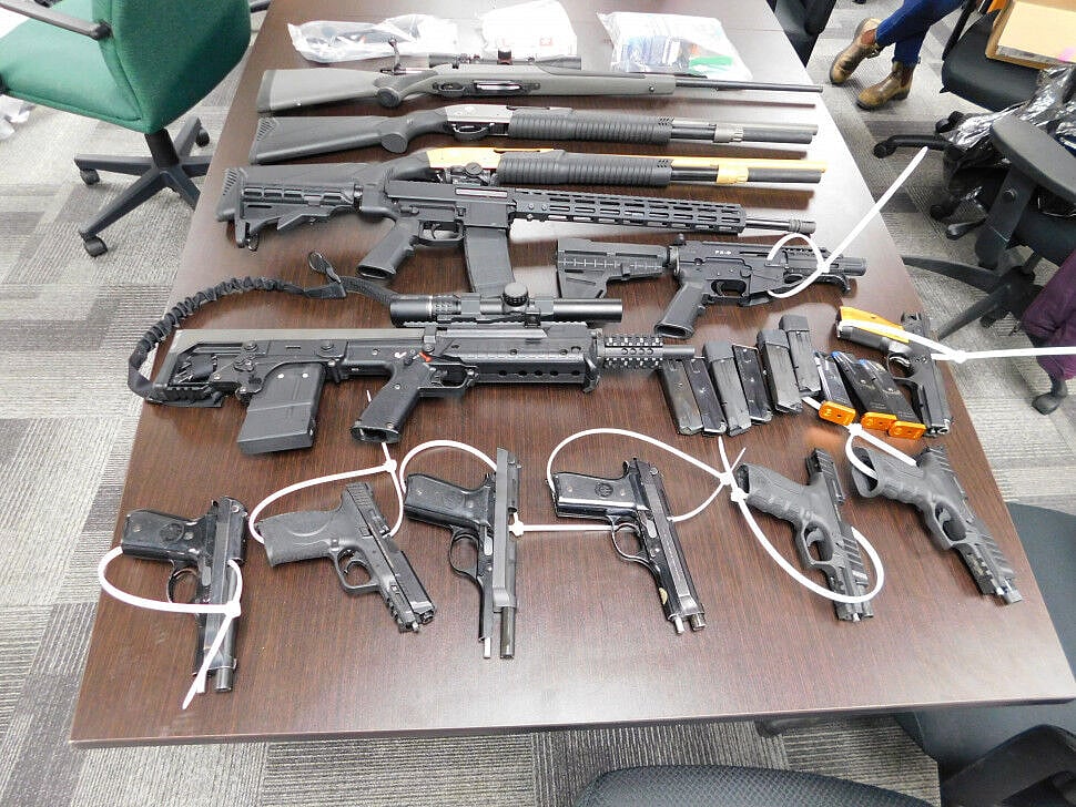 13 guns “scattered” around two Sask homes